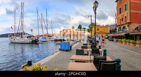 Seaside promenade with colorful restaurants along the Mediterranean Sea ...