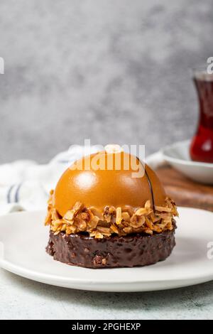 Round caramel cake. Hazelnut and cream portion cake Stock Photo - Alamy