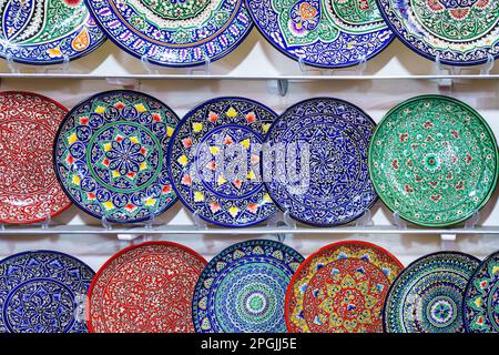 Arabic painted ceramic plates hanging on the wall Stock Photo - Alamy