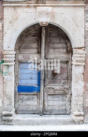 Old weathered doors,& stone arches to be seen in Crete when wandering ...