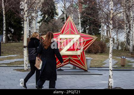 Women walk past an installation of a ìZî letter inside the Red Star ...