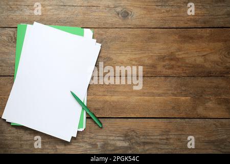 Light green file with blank sheets of paper on white background, top ...