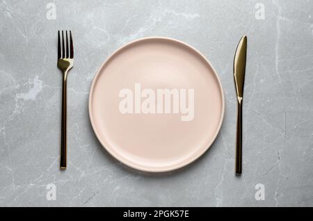 Beautiful table setting on grey cloth Stock Photo - Alamy