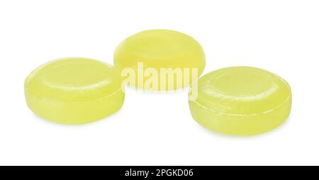 Three yellow cough drops on white background, top view Stock Photo - Alamy