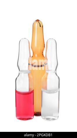 Different ampoules with pharmaceutical products on white background ...