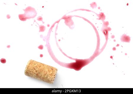 Red wine rings with drops, bung and metal corkscrew on white background ...