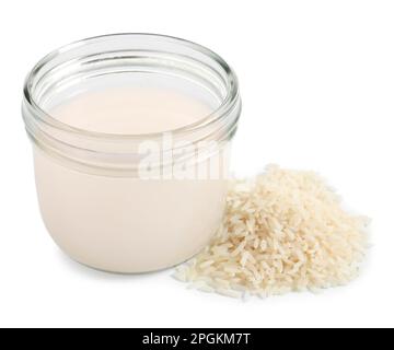 Homemade natural rice water and grains on white background Stock Photo ...