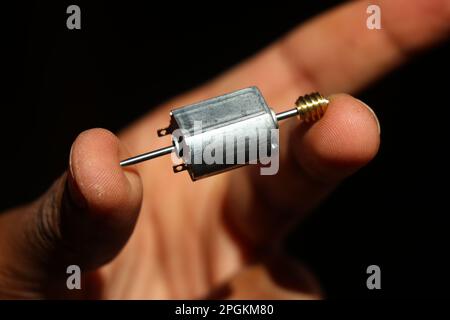 Double shaft dc motor which is very small. DC motors are used to run ...