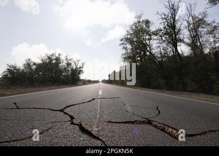 Large cracks on asphalt road after earthquake Stock Photo - Alamy