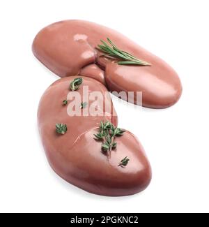 Fresh raw pork kidneys with rosemary and garlic on white background ...