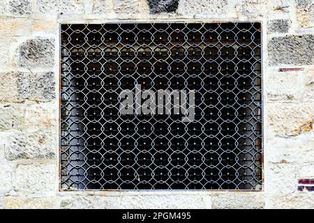 Opening in a wall with grating Stock Photo - Alamy
