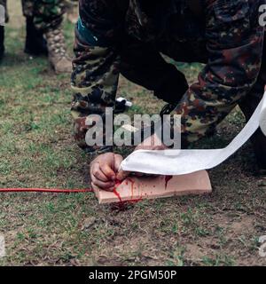 Soldier trains to stop bleeding from a gunshot wound using tamponade on ...