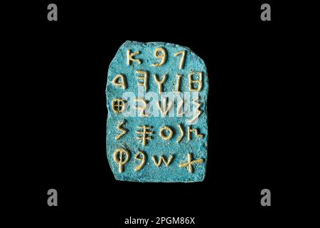 Reproduction of Phoenician alphabet with gilded letters on a stone ...