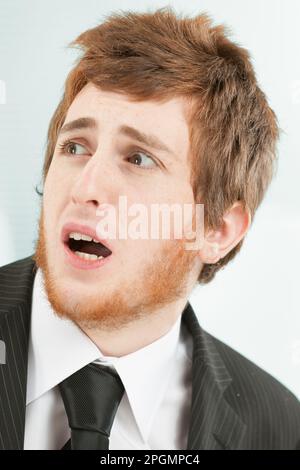 Emotional scared man looks with frightened expression, nervously ...