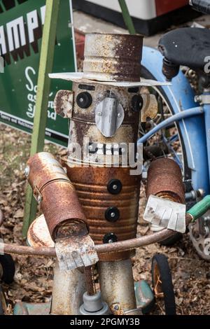 Junk sculpture made from old tin cans on display add a roadside stand ...