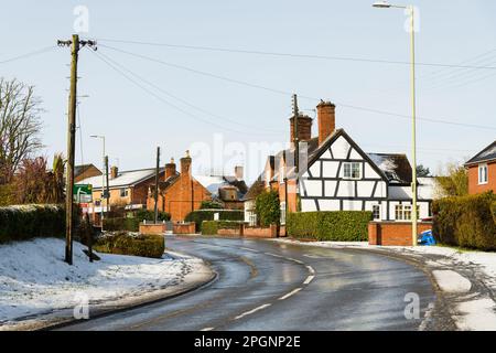 Shawbury, UK - March 10, 2023; Snow covered path with footprints ...