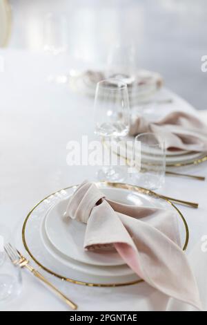 A table set-up with empty plates and glasses outdoors Stock Photo - Alamy