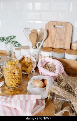 Bags with raw ingredients lying on kitchen counter Stock Photo - Alamy