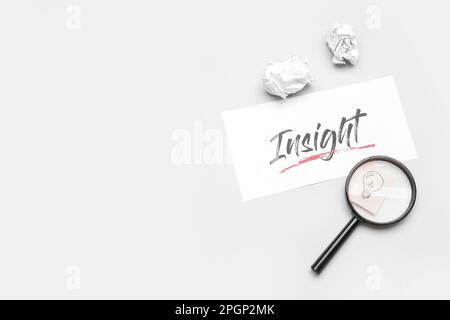 Word INSIGHT, crumpled paper, magnifier and drawn light bulb on light ...