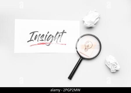 Word INSIGHT, crumpled paper, magnifier and drawn light bulb on light ...