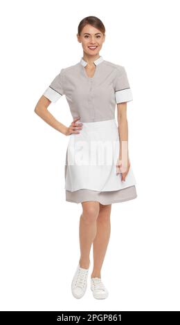 Full length portrait of chambermaid in tidy uniform on white background ...