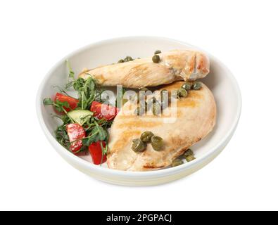 Delicious cooked chicken fillets with capers and salad on white ...