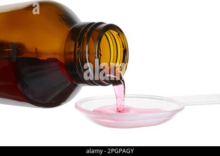Pouring cough syrup into dosing spoon on white background Stock Photo ...