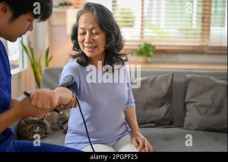 female patient checked heart rate by doctor with stethoscope Stock ...