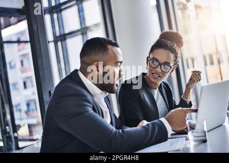 Success comes to those who work hard. a young businessman using a ...