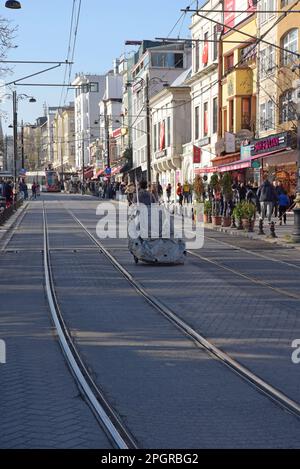 Workers pulling handcarts to collect garbage & recycling on the streets ...