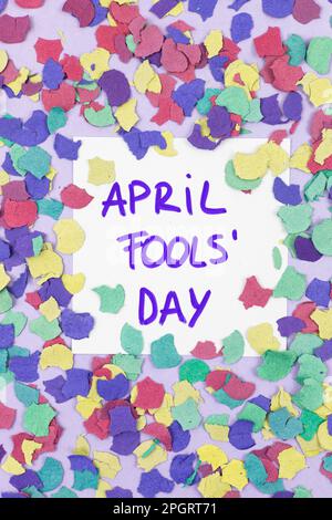 Party decor and text APRIL FOOL'S DAY on yellow background Stock Photo ...