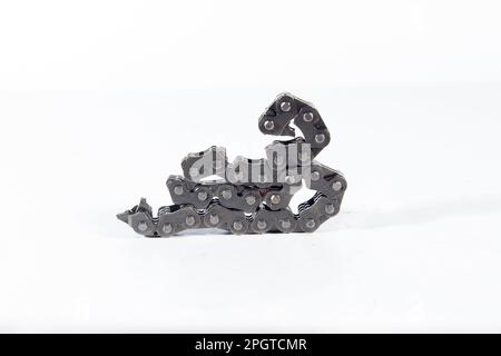 Old chains inside the motorcycle engine on a white background ...