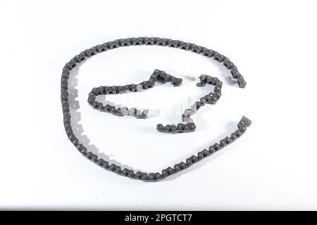 Old chains inside the motorcycle engine on a white background ...