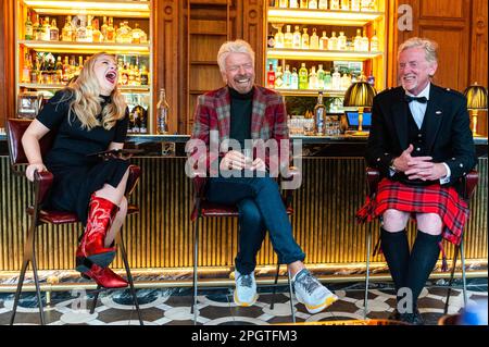 James Bermingham, left, Sir Richard Branson and John Lam participate in ...
