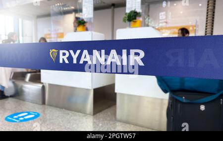 Blue barrier tape with the Ryanair logo inside an airport Stock Photo ...