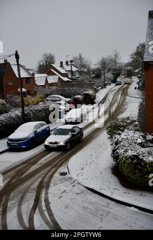 School Bus travelling in Hook Norton collecting School Children Stock ...