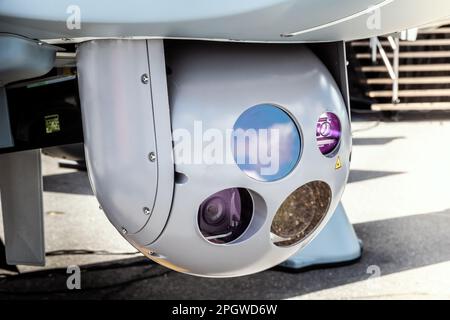 Camera sensor pods under an unmanned aerial surveillance drone aircraft ...