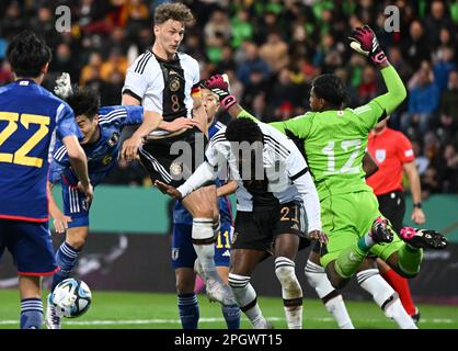 Japan's goalkeeper Zion Suzuki, right, makes a safe during the friendly ...