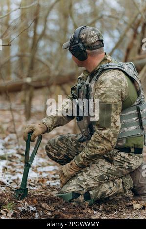 Preparation for the attack. Digging a trench Stock Photo - Alamy