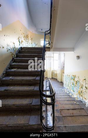 Top view of an old rectangular spiral staircase in an old abandoned ...