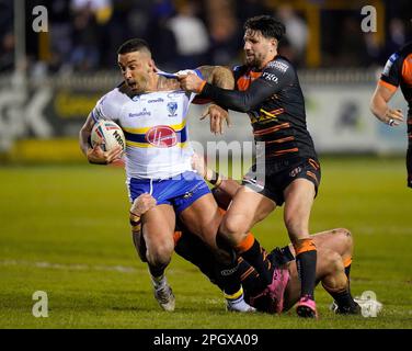 Paul Vaughan of Warrington Wolves is tackled during the Betfred Super ...