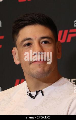 UFC flyweight fighter Brandon Moreno, of Mexico, poses on the scale ...