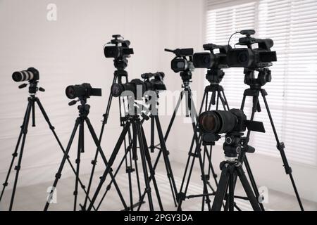 Modern video cameras indoors. Professional media equipment for ...