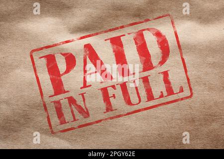 Kraft paper with stamp PAID IN FULL, top view Stock Photo - Alamy