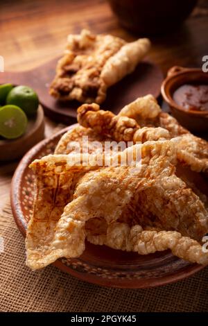 Chicharron. Crispy Fried pork rind, are pieces of aired and fried pork ...