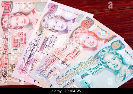 Gibraltar money - pounds - older serie, a business background, reverse ...