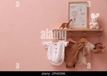 Shelf with toys and picture on wall in children's room, closeup Stock ...