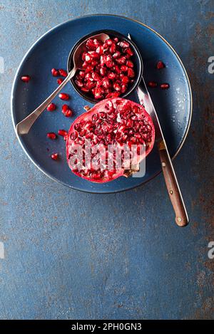 An opened pomegranate on a table in Bangkok, Thailand Stock Photo - Alamy