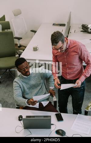 The boss telling his employees about their new job for the client at ...