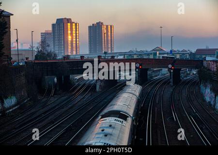 Sunrise reflected on buildings at Clapham Junction station Stock Photo ...